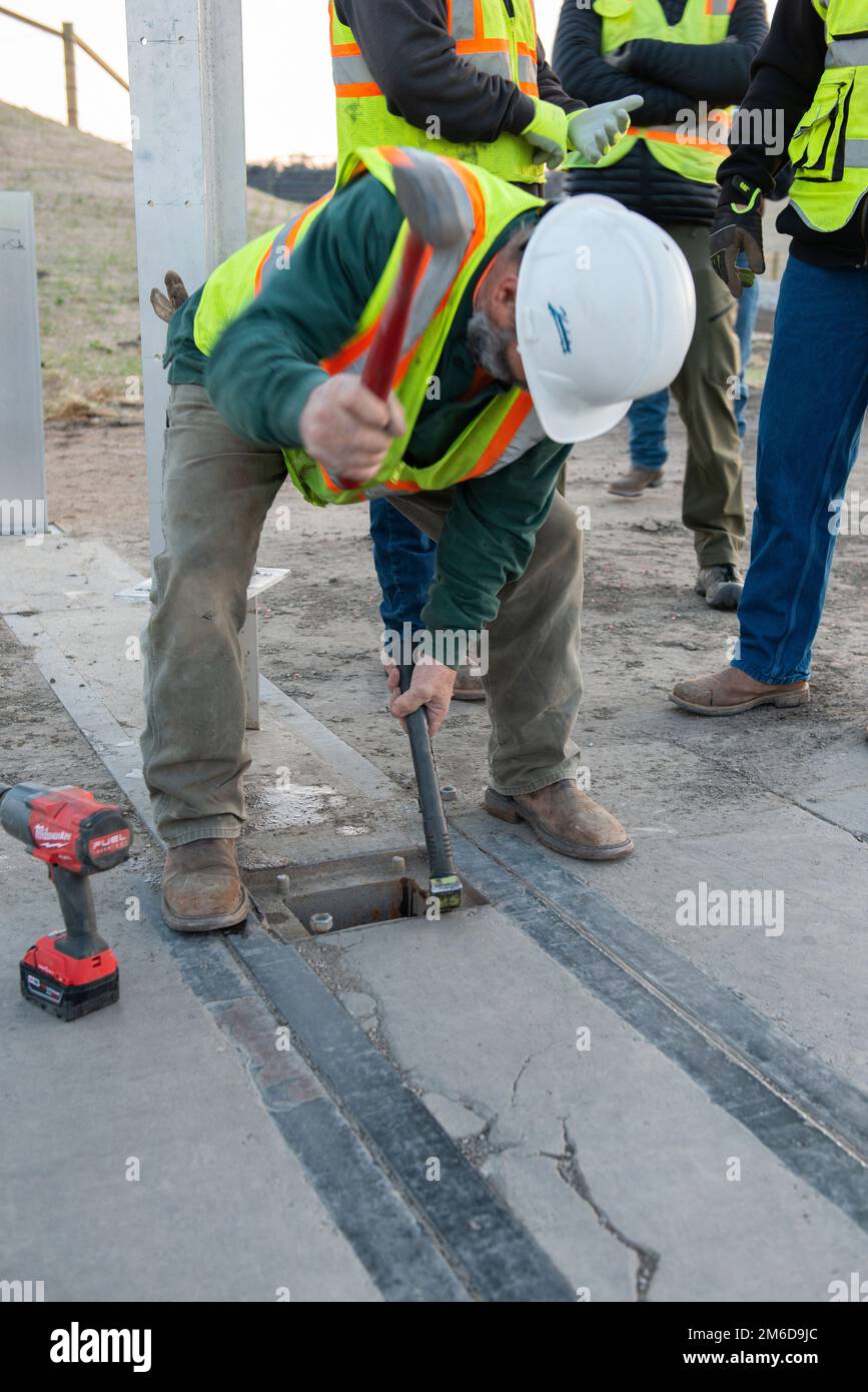 Contractors make sure that the footings for flood gate panels along the ...