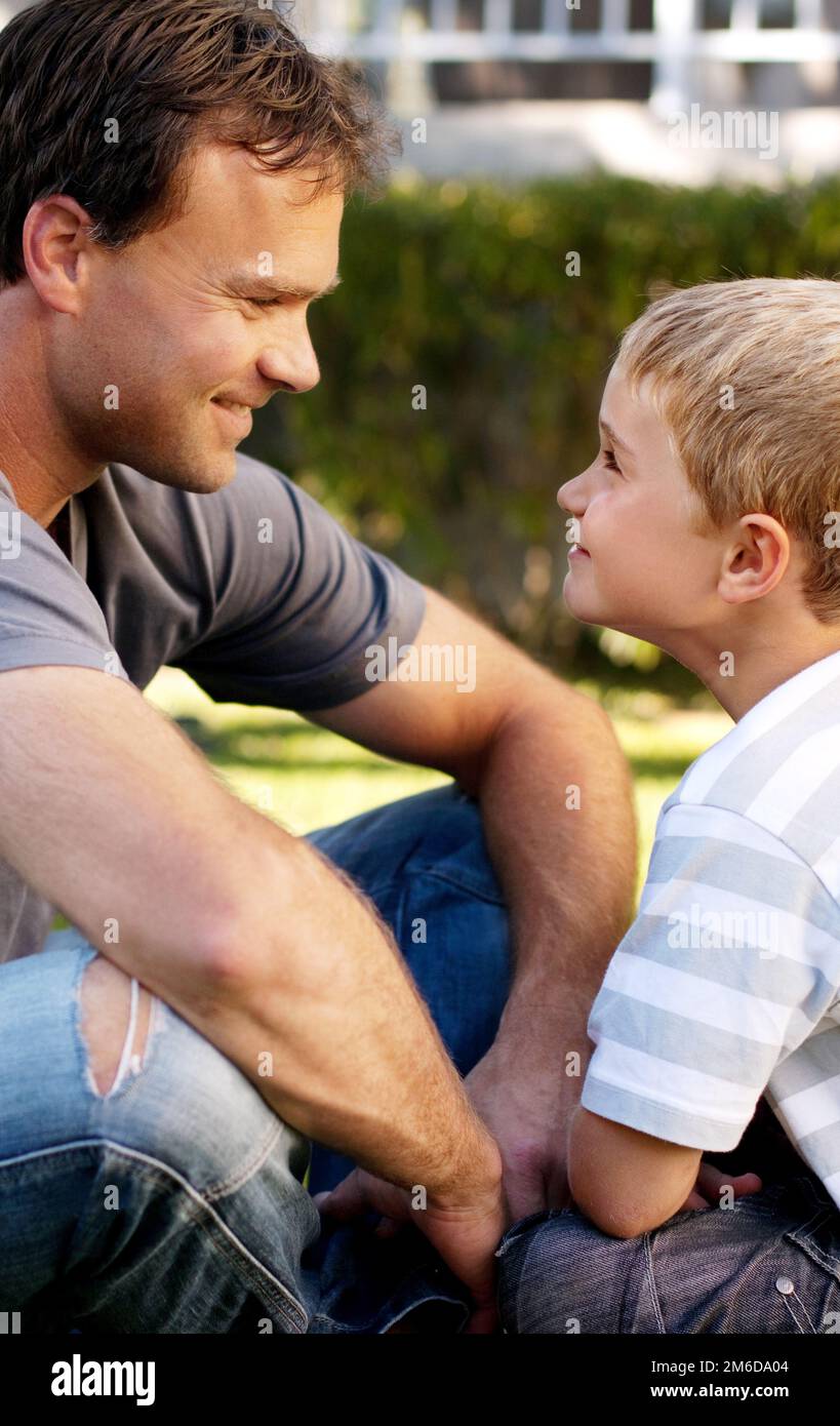 A father and son moment. Little boy mimicking his father smiling Stock ...