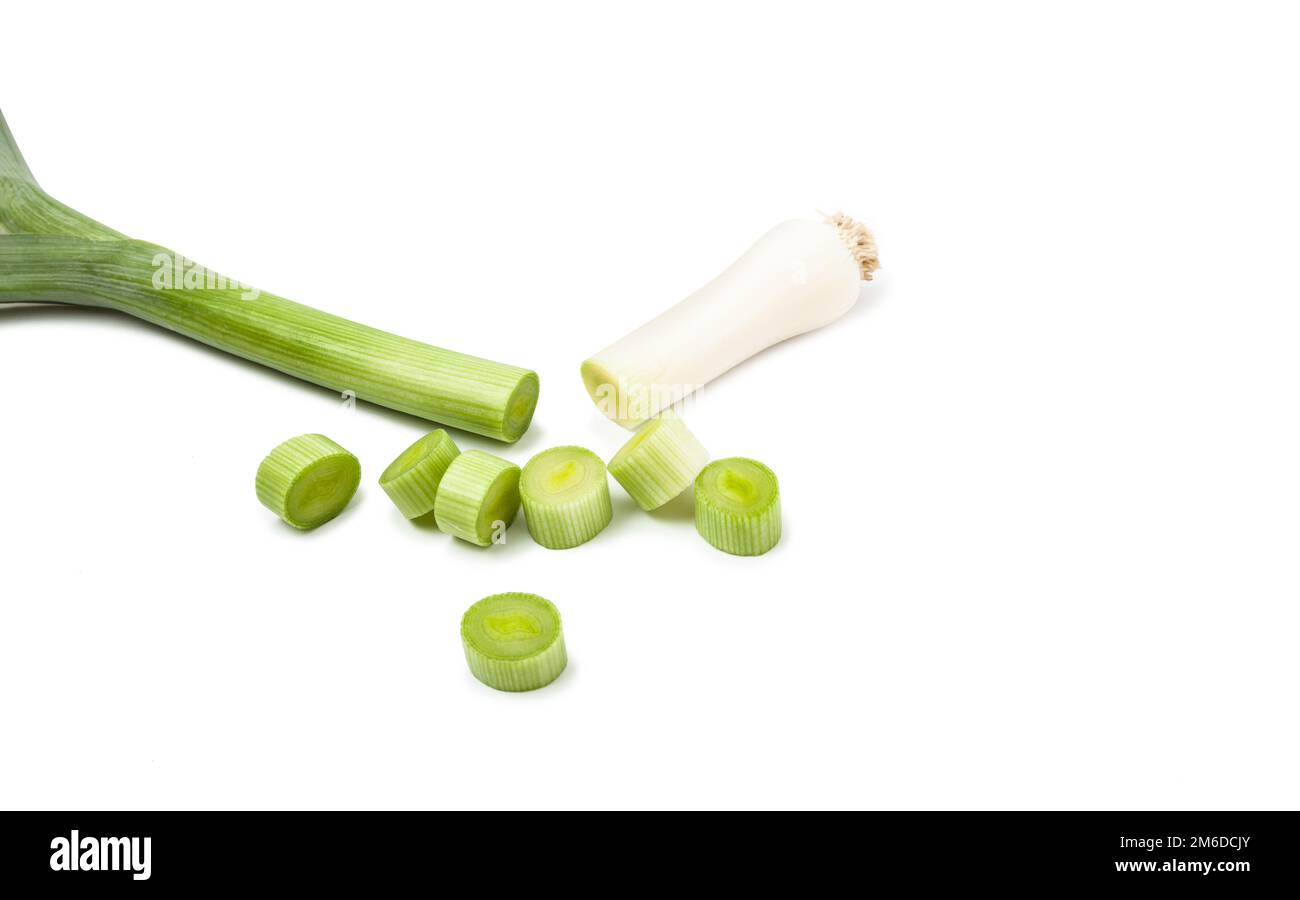 Fresh green leek sliced isolated on white background Stock Photo - Alamy