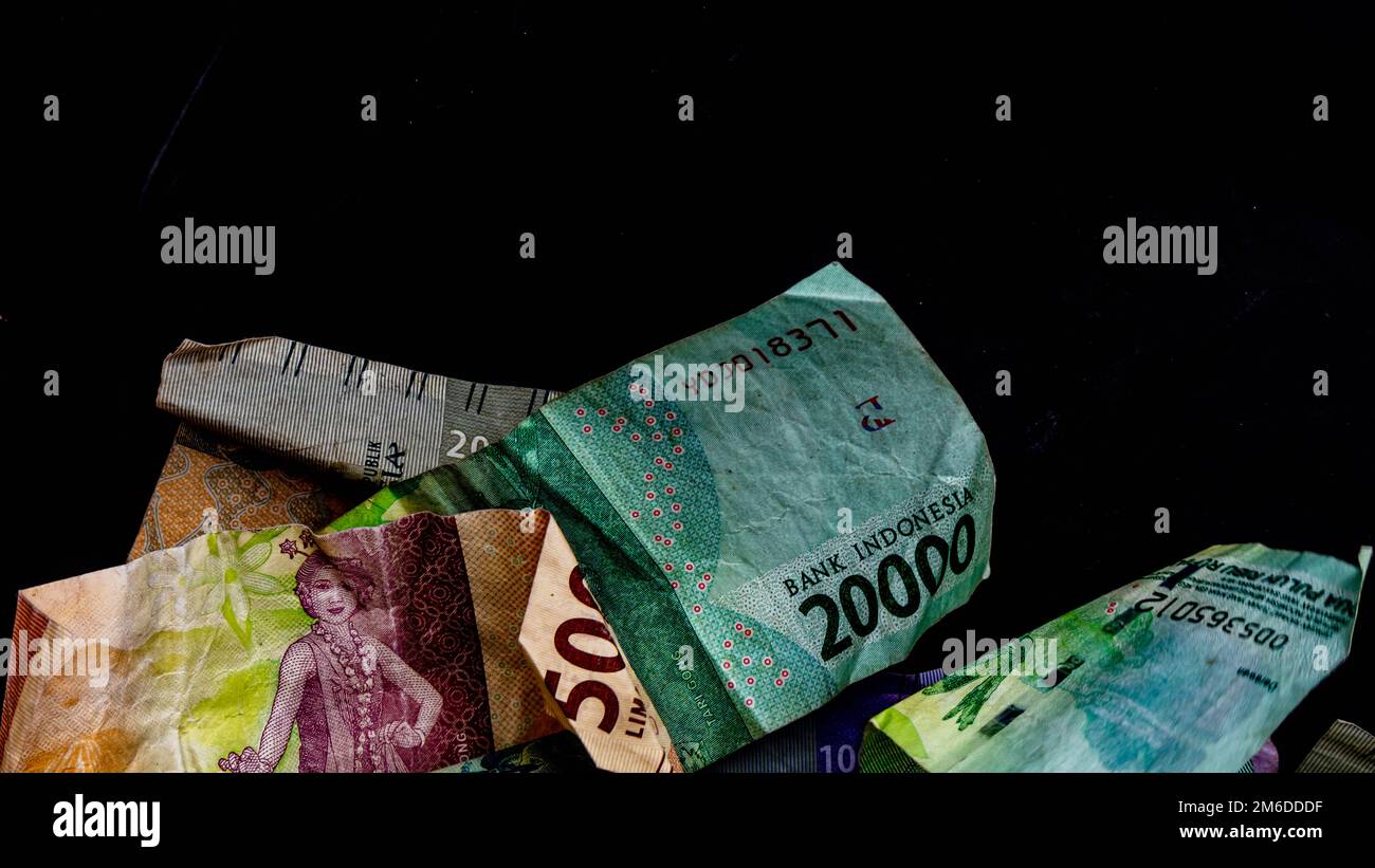 pile of rupiah banknotes as background Stock Photo - Alamy