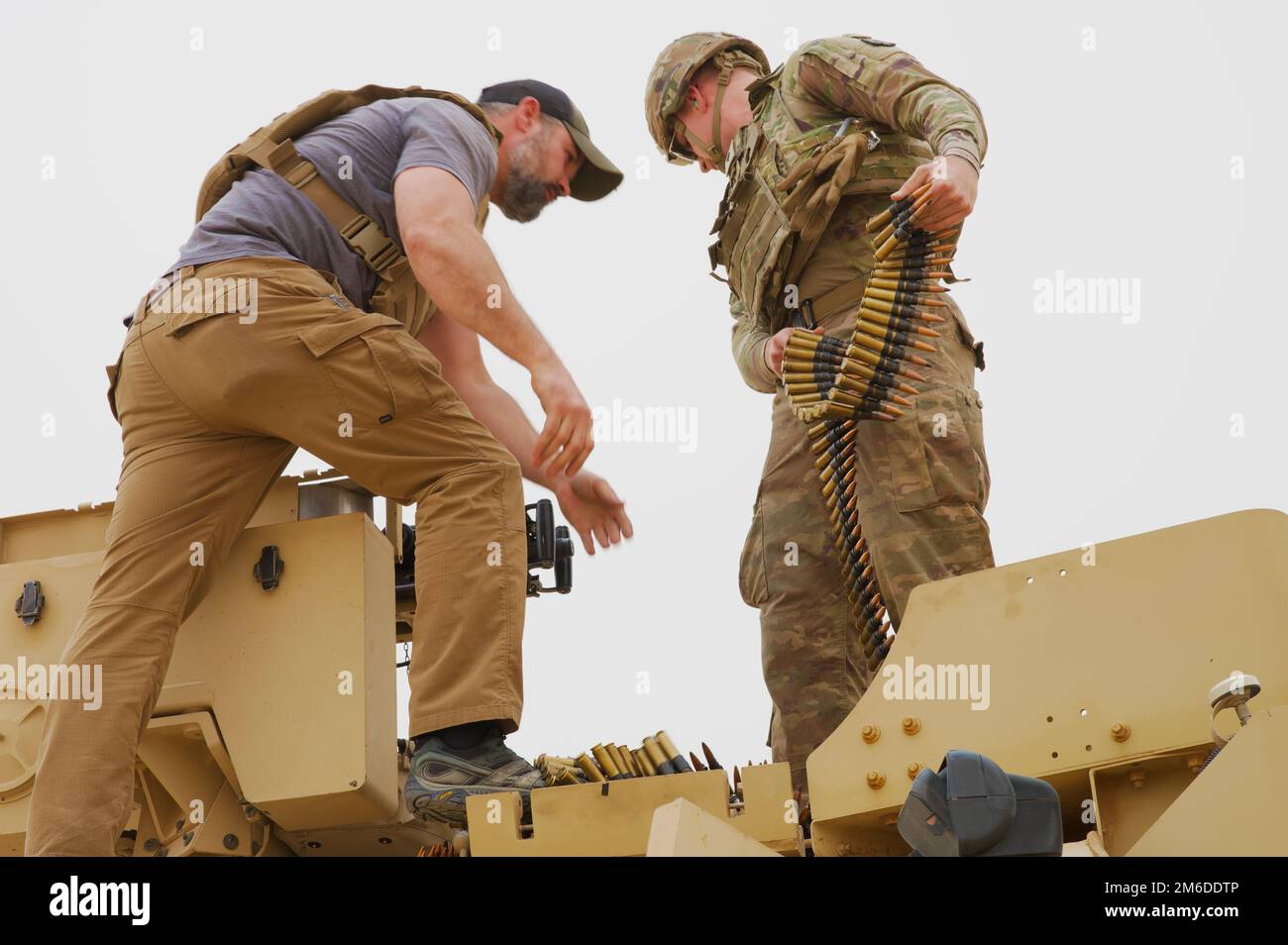 U.S. Army Spec. Logan Socia, right, a wheeled vehicle mechanic assigned ...