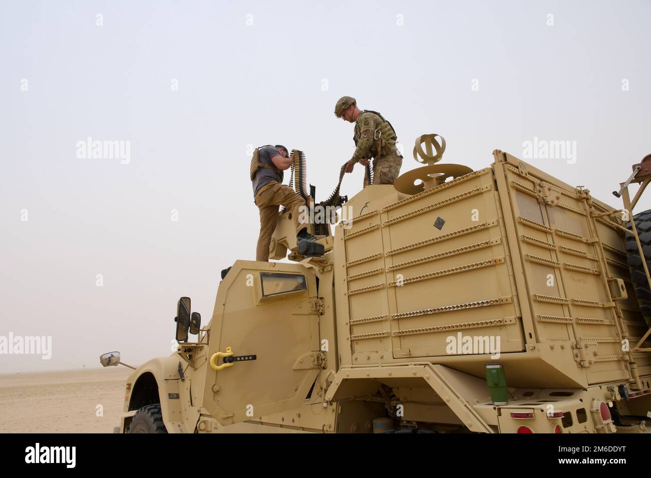 U.S. Army Spec. Logan Socia, right, a wheeled vehicle mechanic assigned ...