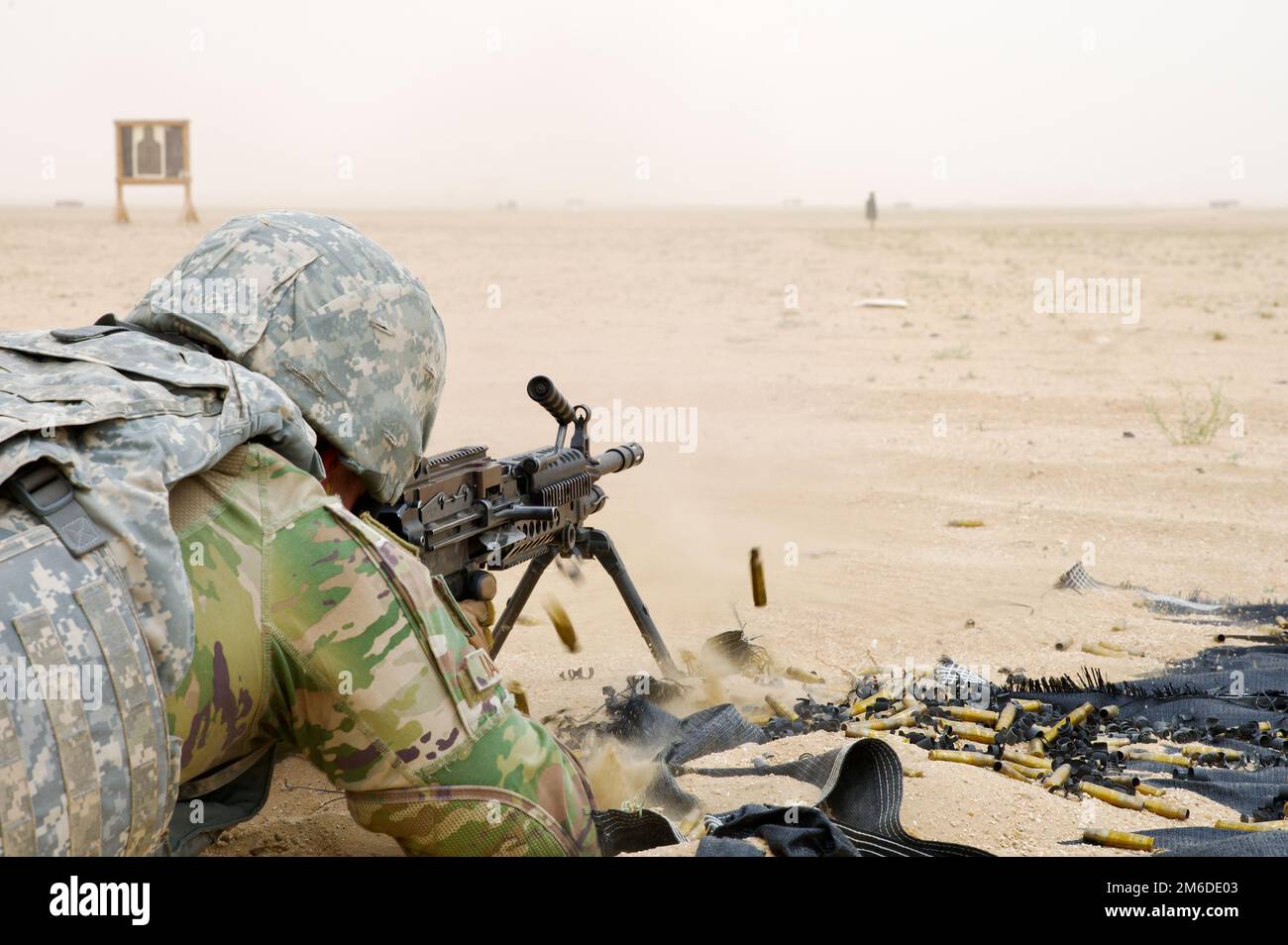 A U.S. Airman shoots an MK48 machine gun at the Udari Multi-Purpose ...