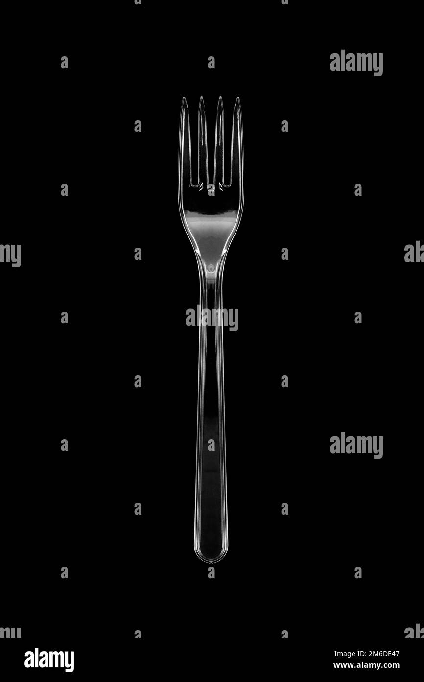 Top view of the transparent plastic fork isolated on black Stock Photo ...
