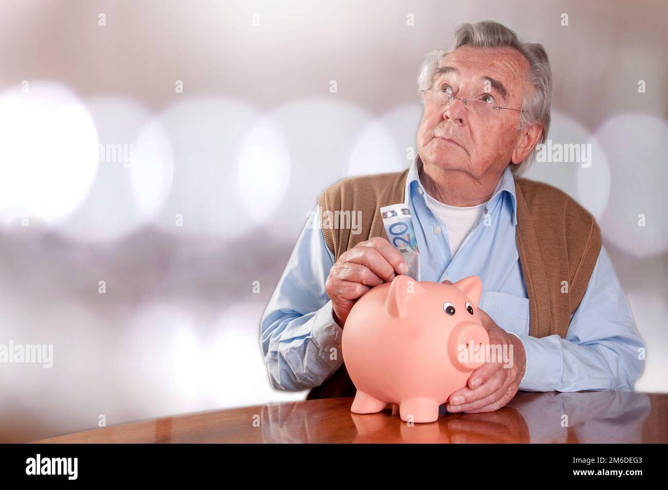 Business man putting money in hi-res stock photography and images - Alamy