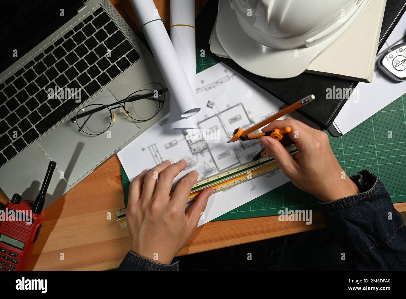 Engineer or architect man working with blueprints, planning development ...