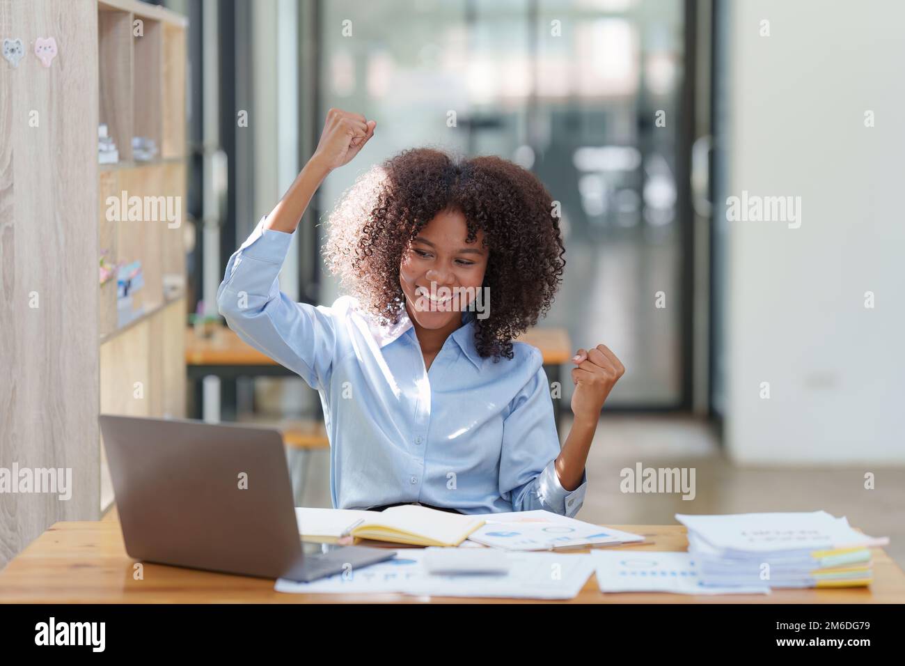 Black businesswoman work on laptop feel euphoric winning. Excited ...