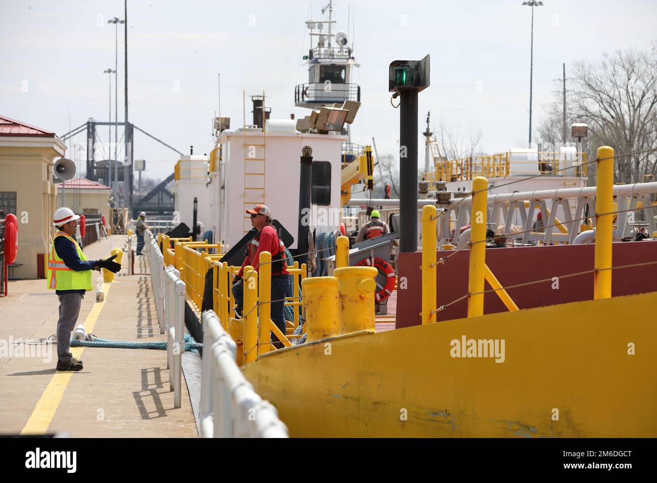 U.S. Army Corps of Engineers Lock and Dam Operator Scott Newman helps ...