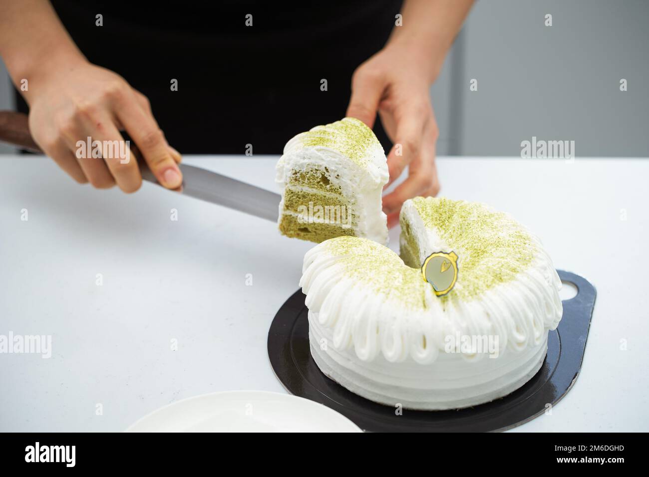 Green tea fresh cream cake cross section Stock Photo - Alamy