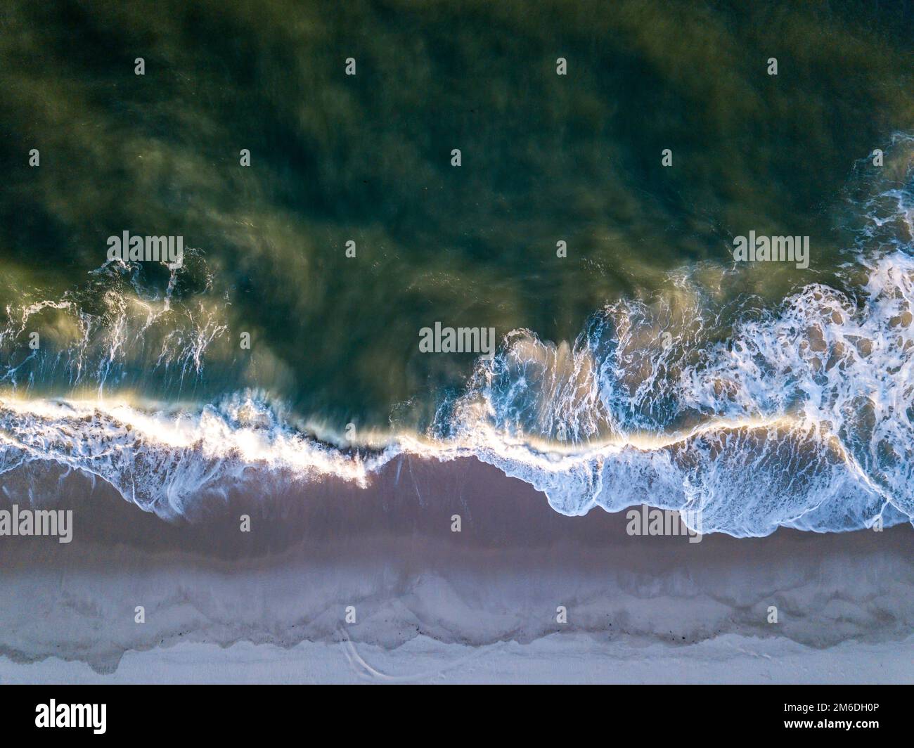 Drone picture of waves hitting the beach Stock Photo - Alamy