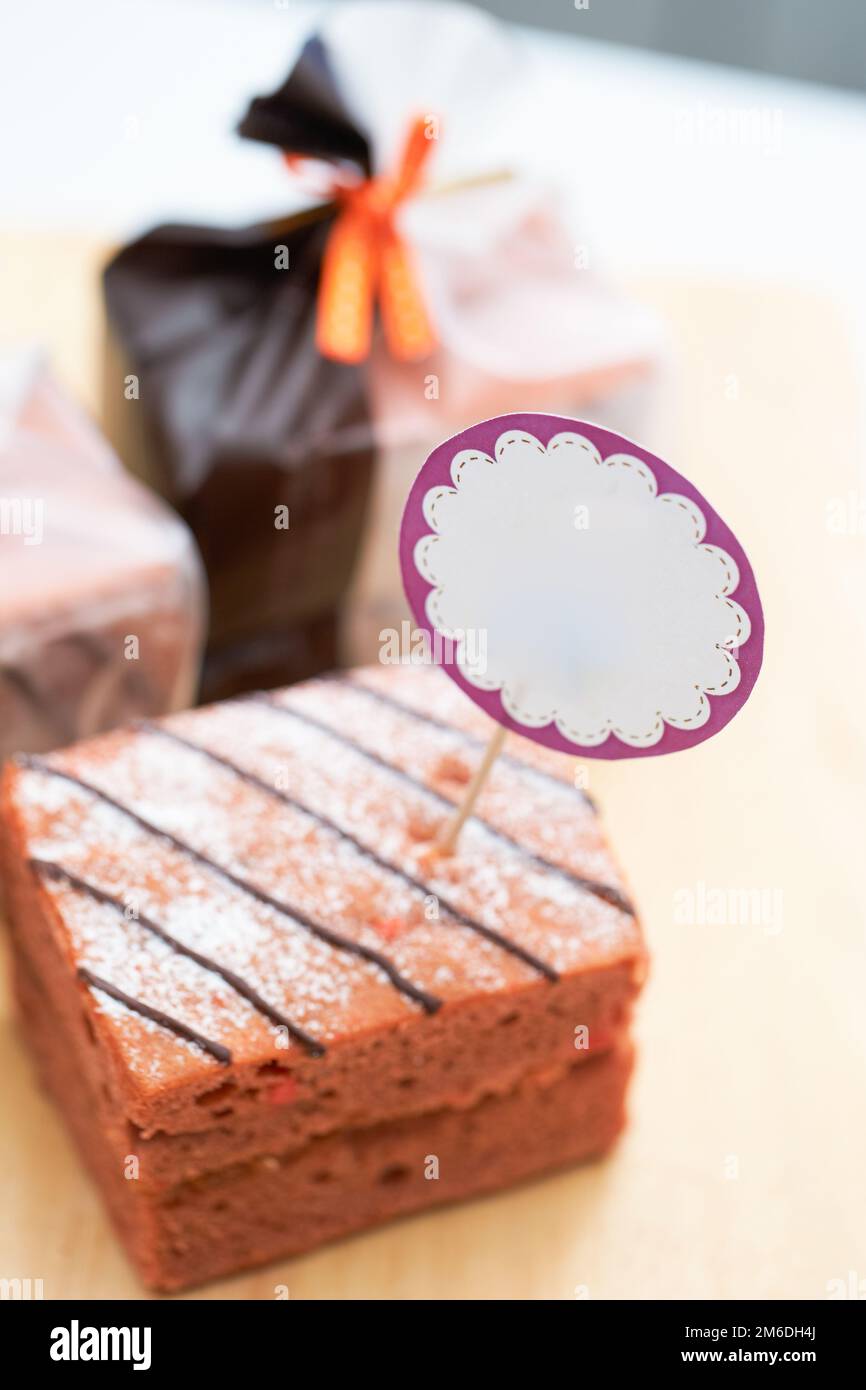 Chocolate piece cake and gift wrapping Stock Photo - Alamy