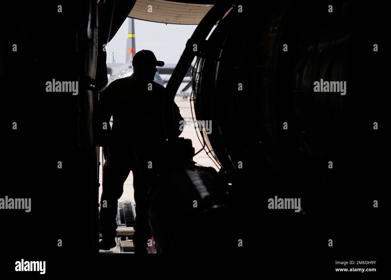 U.S. Air Force loadmasters assigned to the 146th Airlift Wing prepare ...