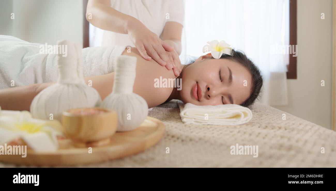 Beautiful woman being massaged hi-res stock photography and images - Alamy
