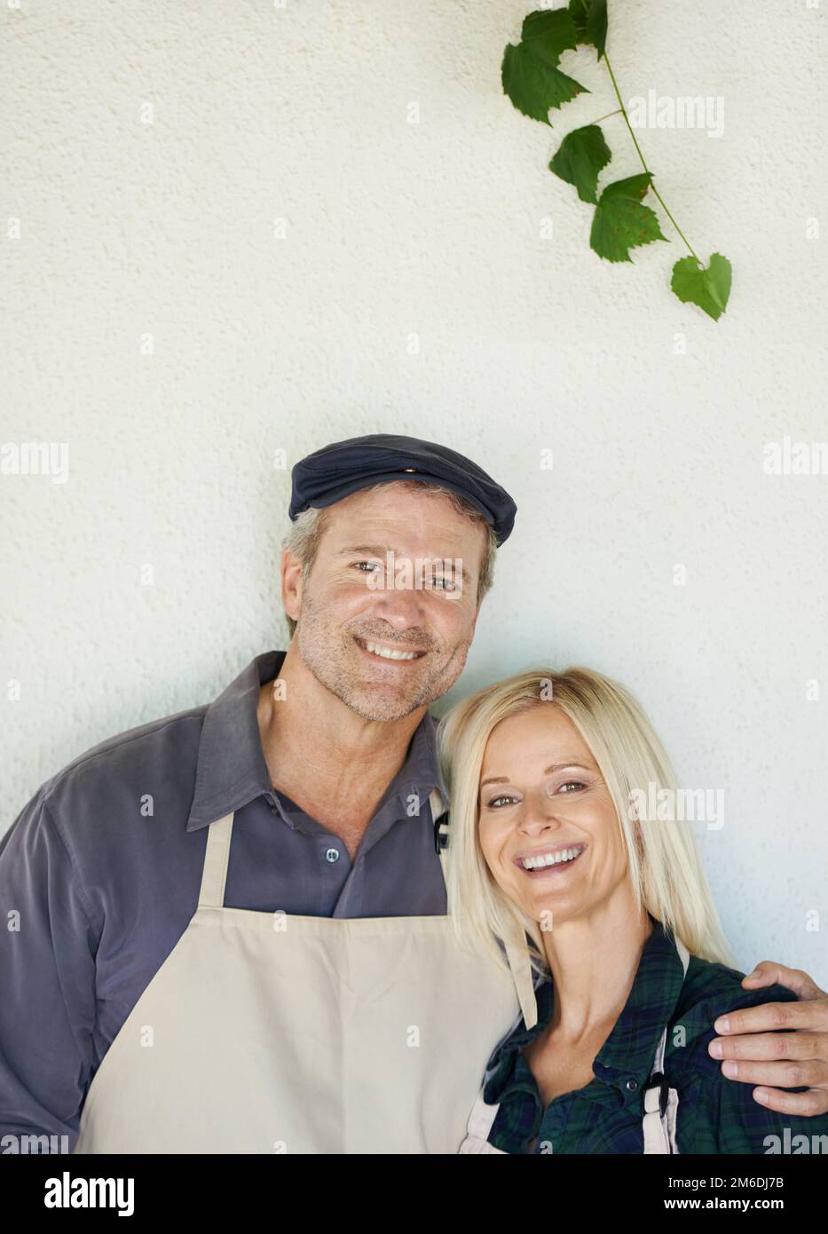 They match up in every way. A farmer and his wife standing in front of ...