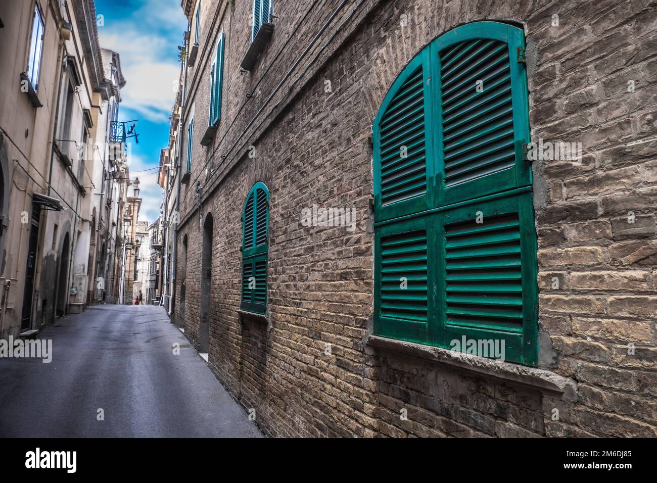 Hdr deep narrow alley ground floor window house Stock Photo - Alamy