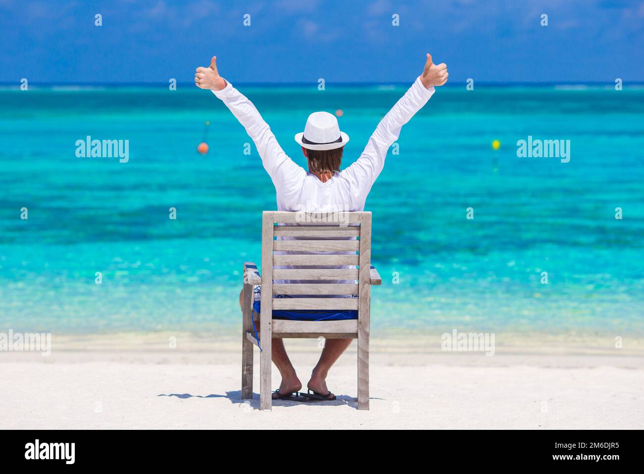 Young man at summer vacation on tropical beach Stock Photo - Alamy
