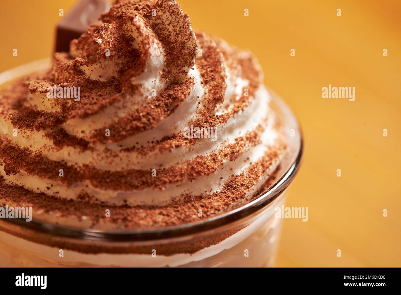 Chocolate powder sprinkled over whipped cream Stock Photo - Alamy