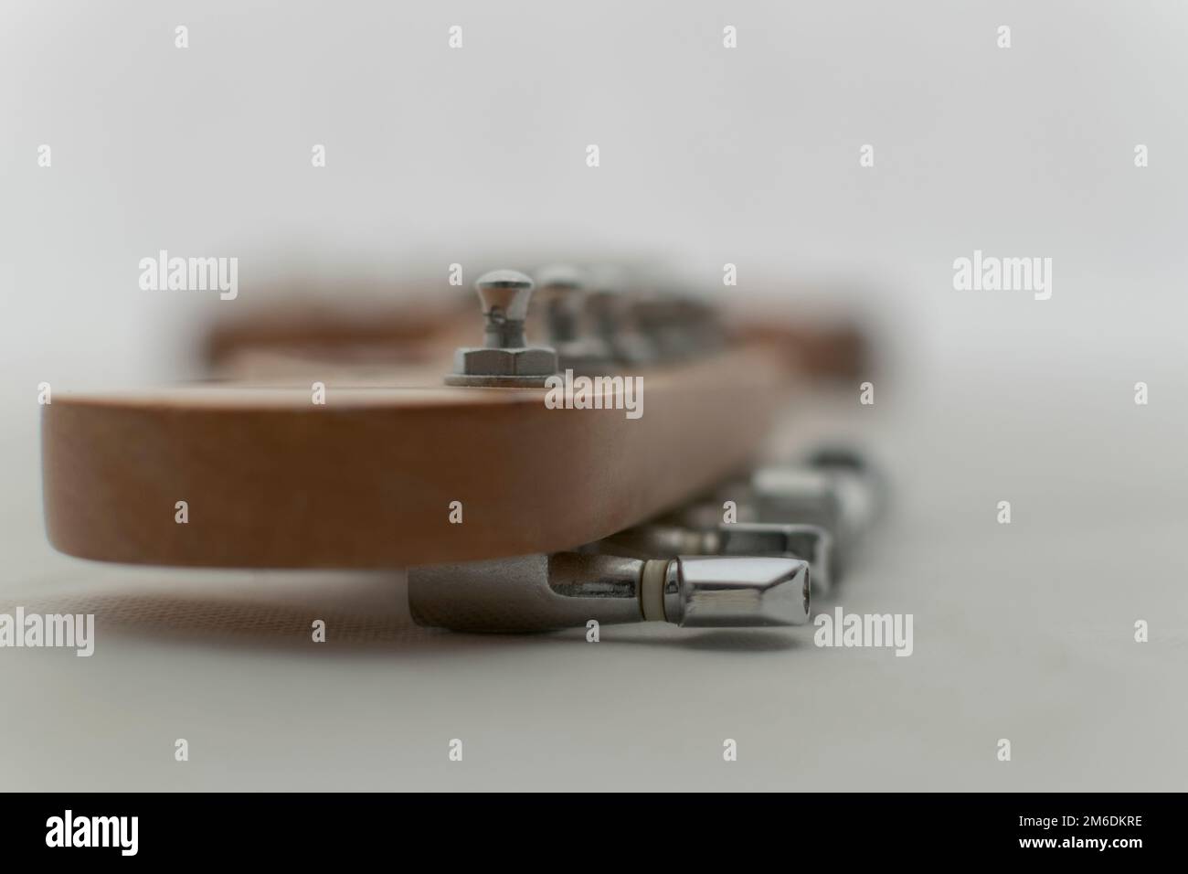 Electric guitar fretboard on white background Stock Photo - Alamy