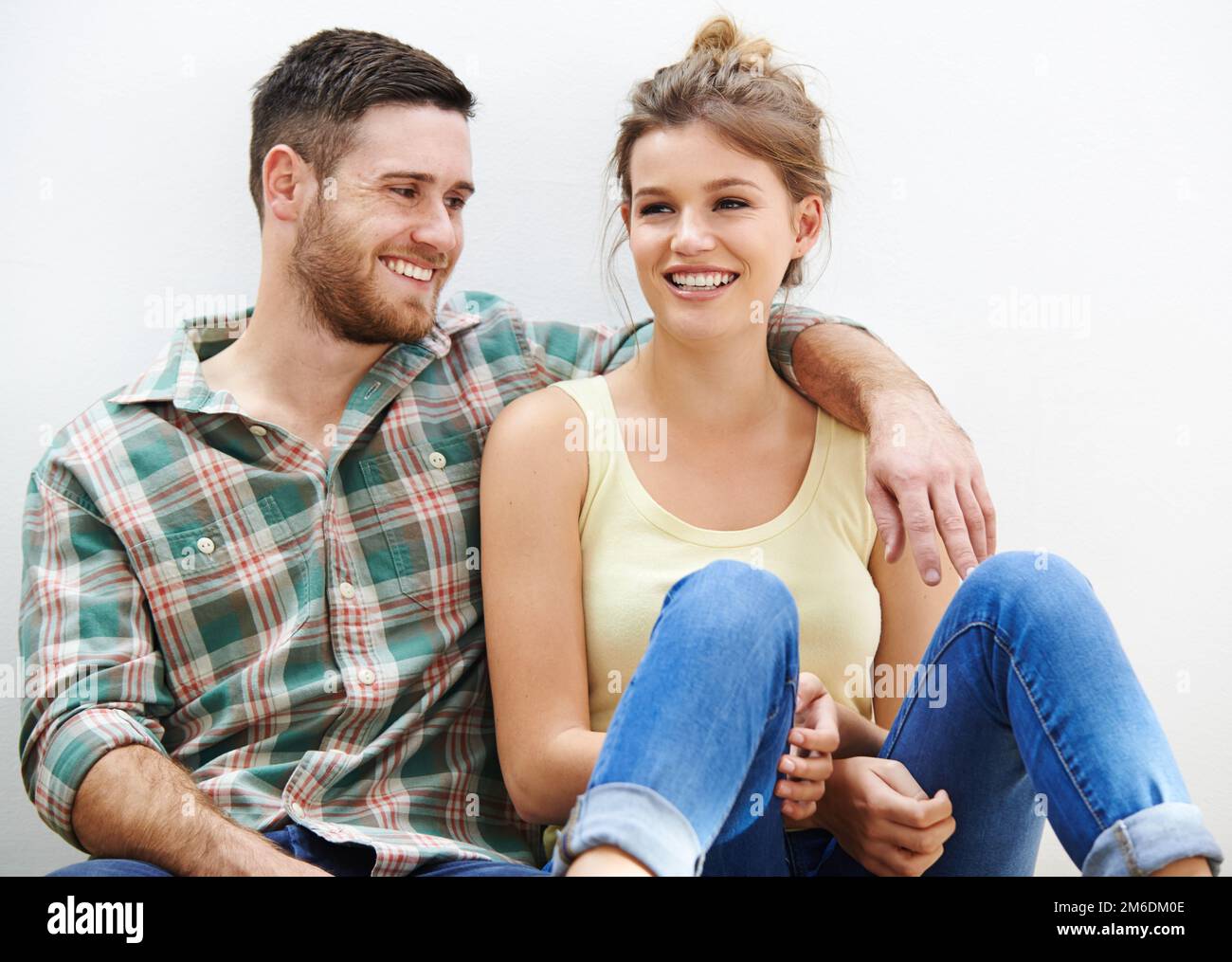 Theres nothing better than feeling loved. a loving young couple sitting ...