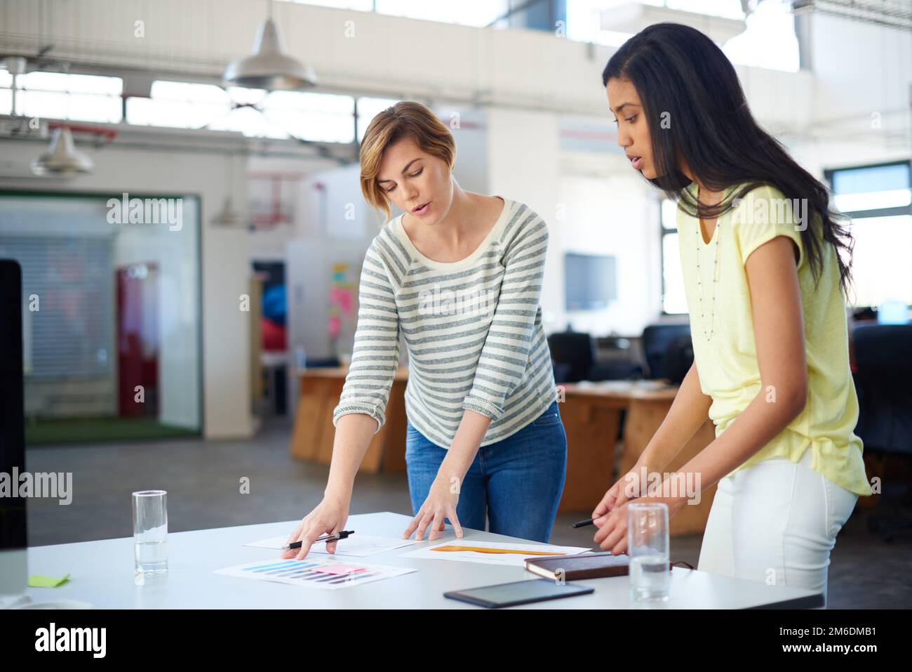 Double the decision making. two colleagues having a brainstorming ...
