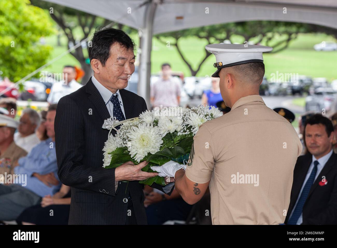 Yutaka Aoki, left, Consul-General of Japan in Honolulu, receives a ...