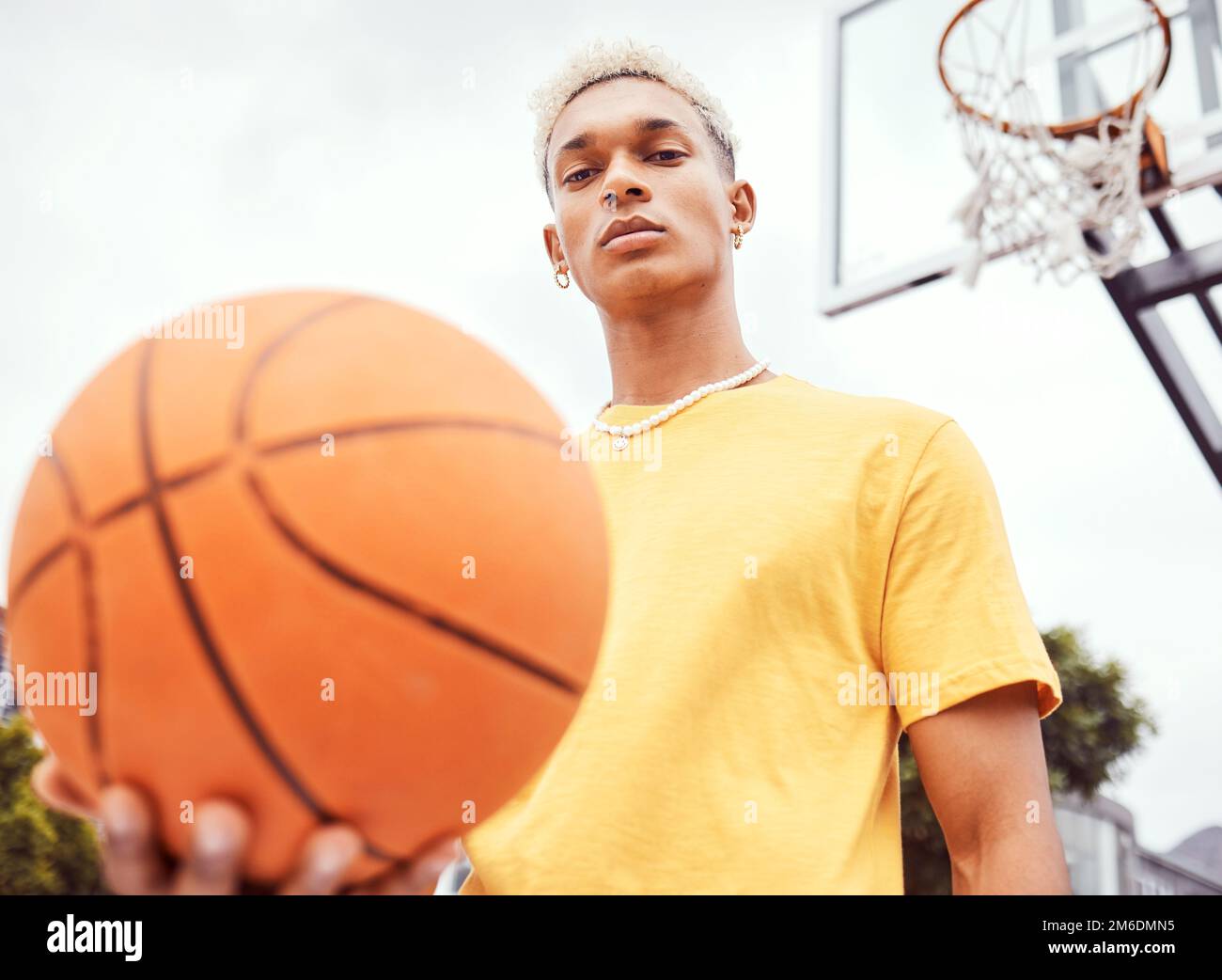 Sports, basketball court and a portrait of man with ball outside at ...