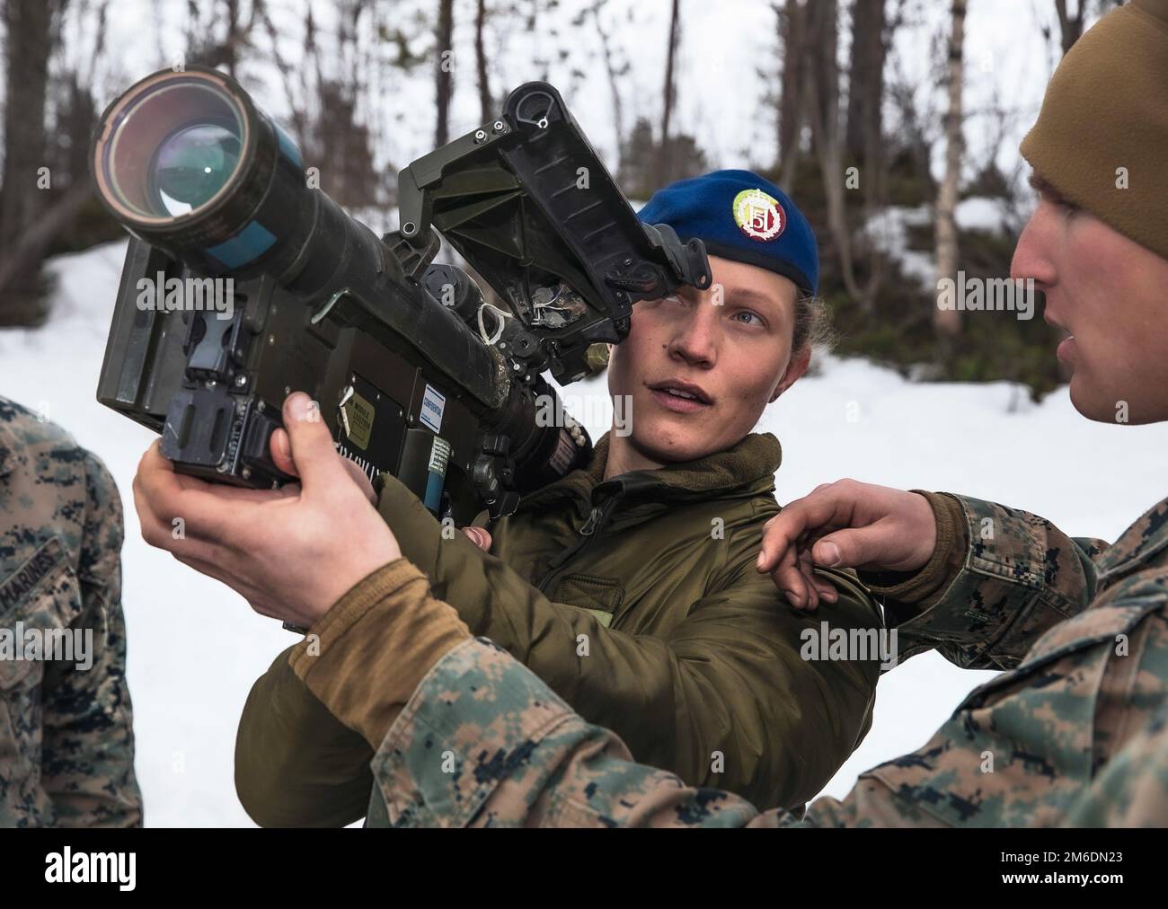 U.S. Marines Corps Lance Cpl. Dylan Pennington, right, assigned to the ...