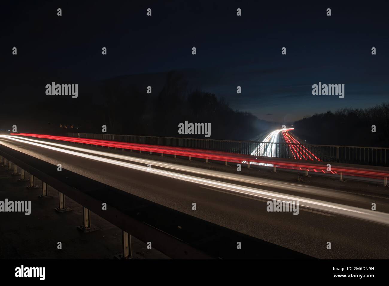 Light trails of moving cars on the motorway Stock Photo - Alamy