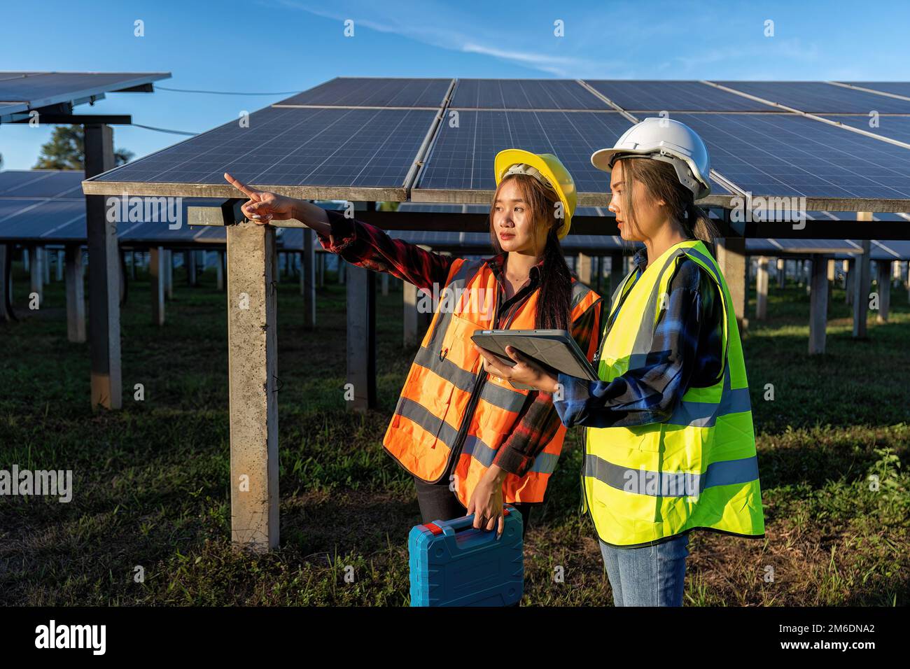 2 maintenance girl engineer carry tool box routine maintenance at ...