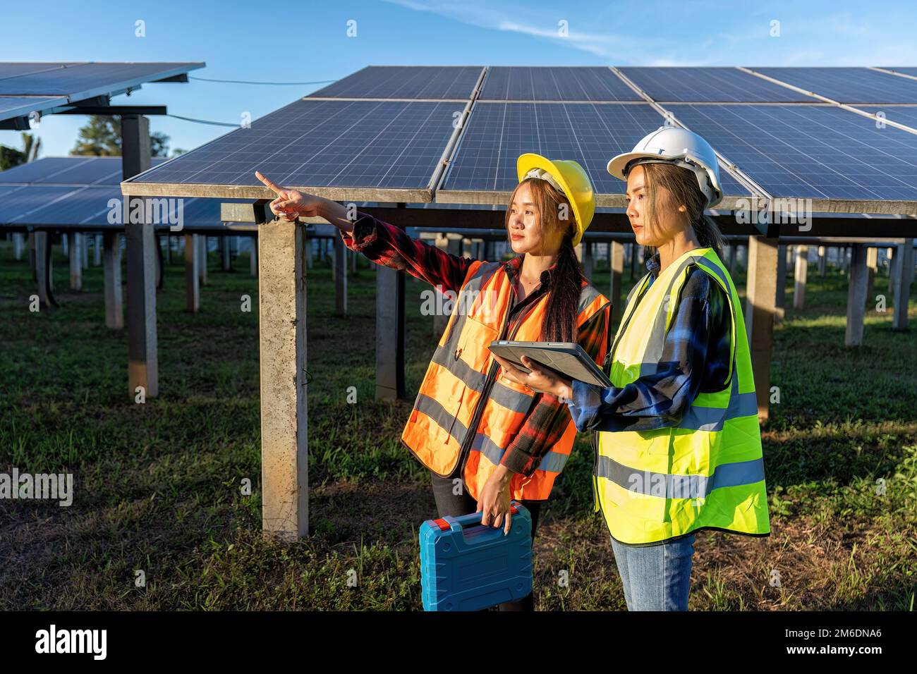 2 maintenance girl engineer carry tool box routine maintenance at ...