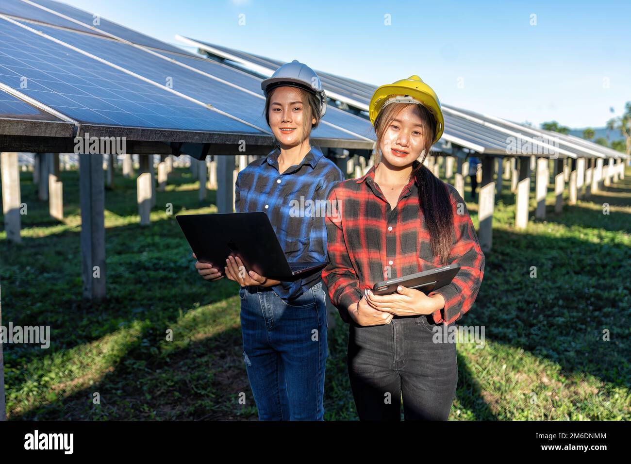 2 maintenance girl engineer hold tablet happy smiling work at village ...