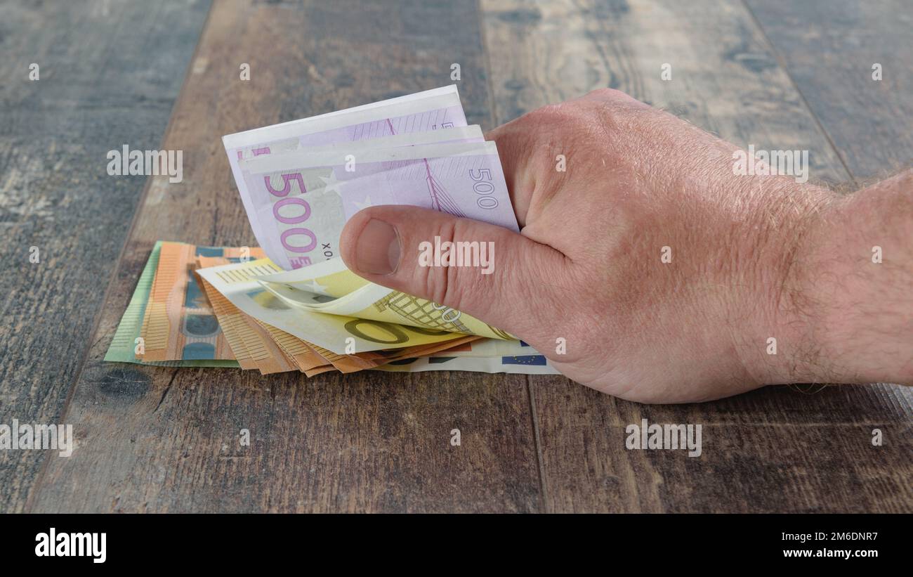 Cash in the hand. Euro large banknotes close-up. European payment ...