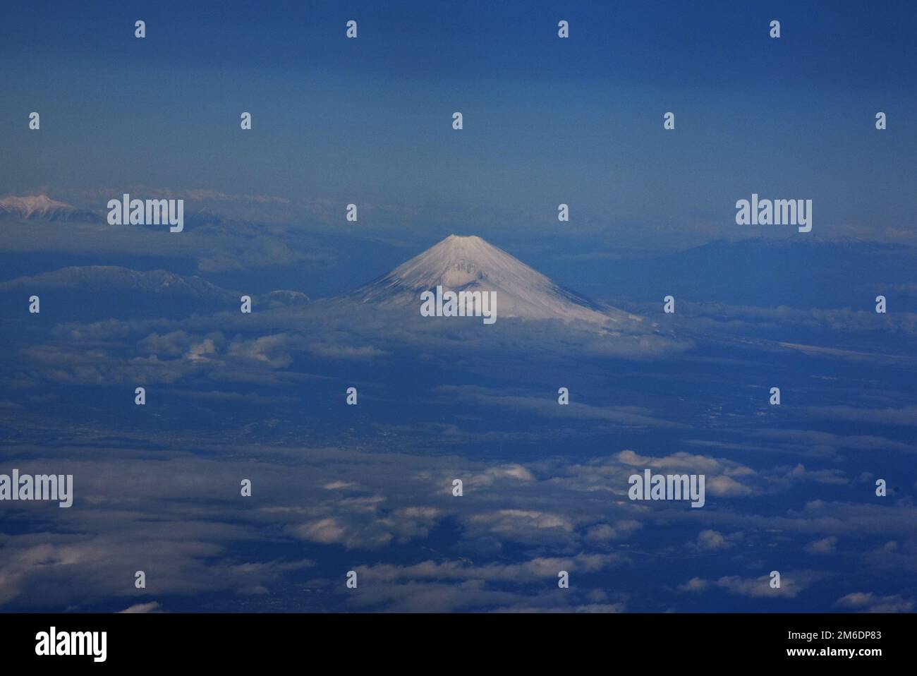 View of sacred Mount Fuji seen from the airplane, snowy summit in ...