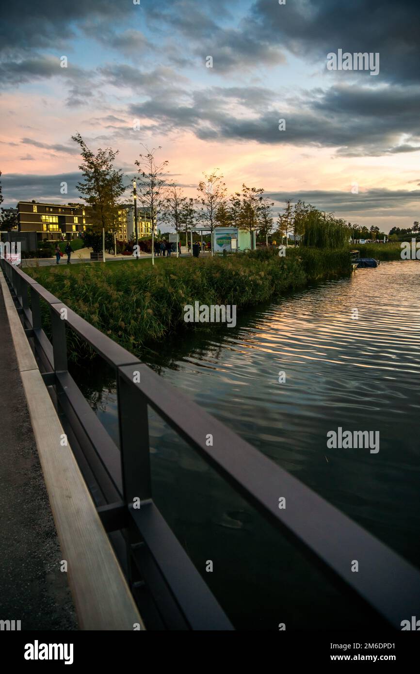 Sunset at neckar side river wooden bridge Stock Photo - Alamy