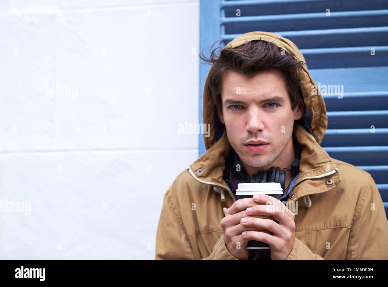 Out and about, around downtown. a handsome young man chilling in a ...