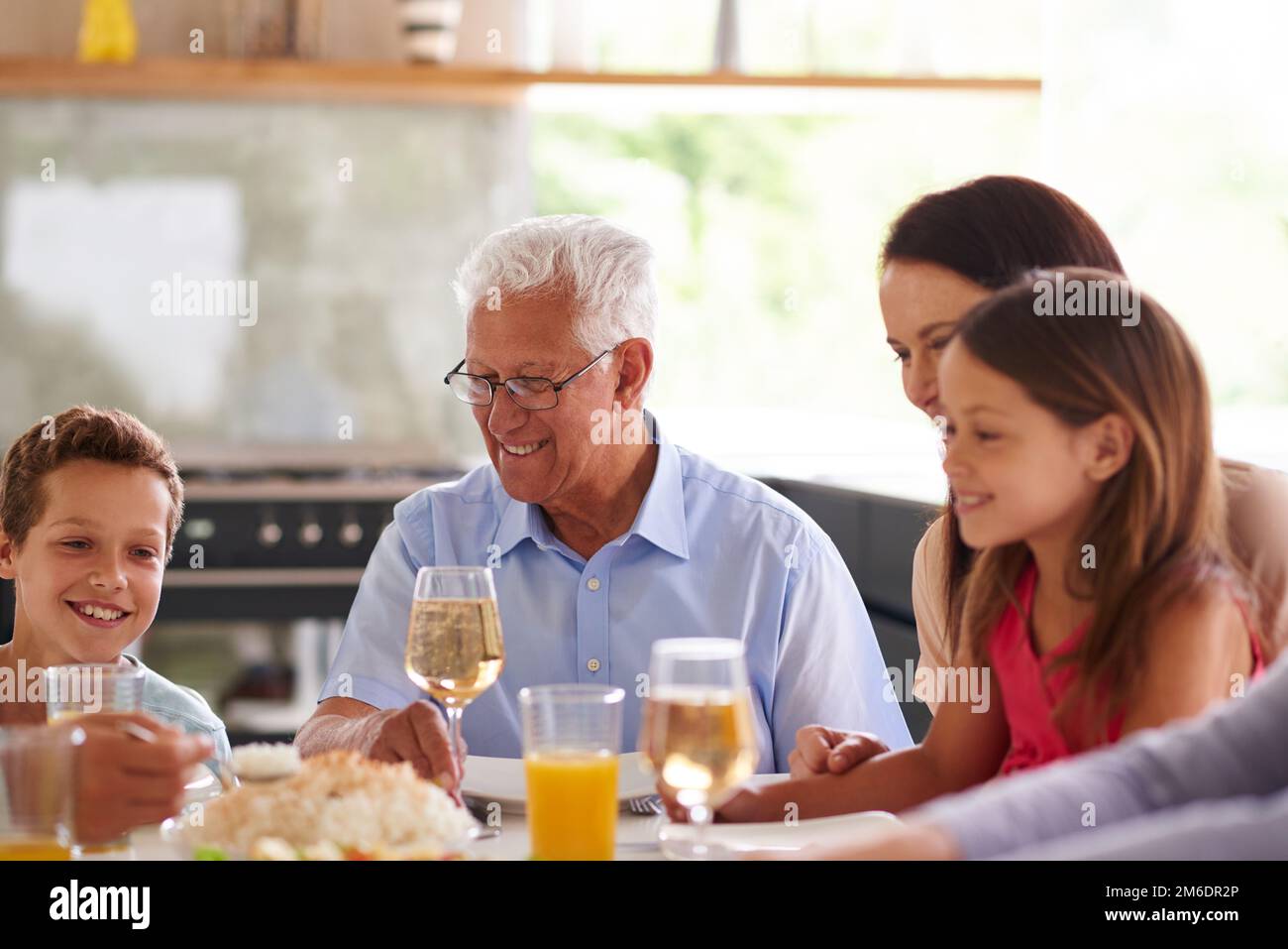Family lunches are the most fun. a family having lunch together Stock ...