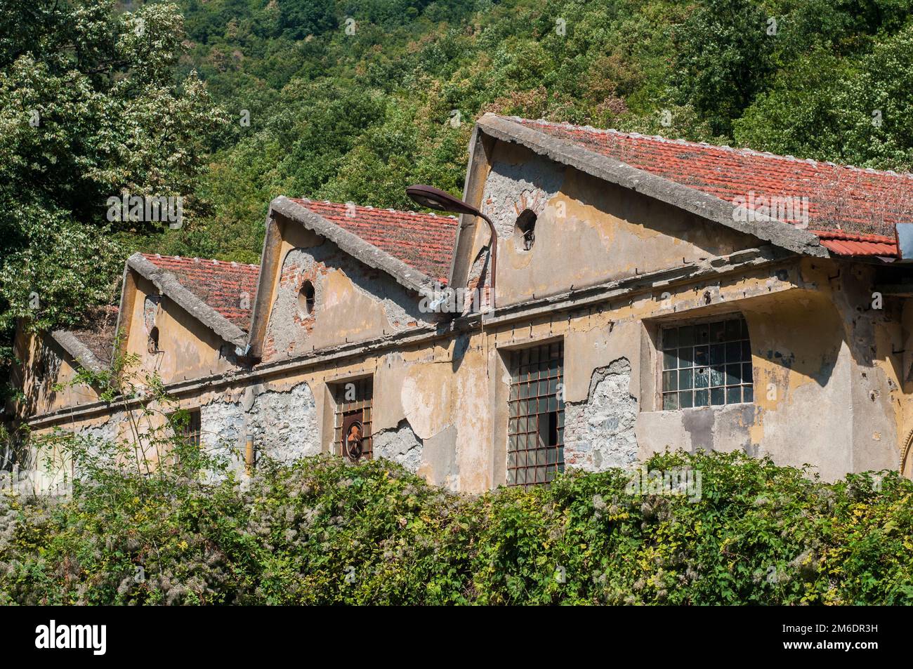 Old obsolete industrial building facade with broken windows Stock Photo ...