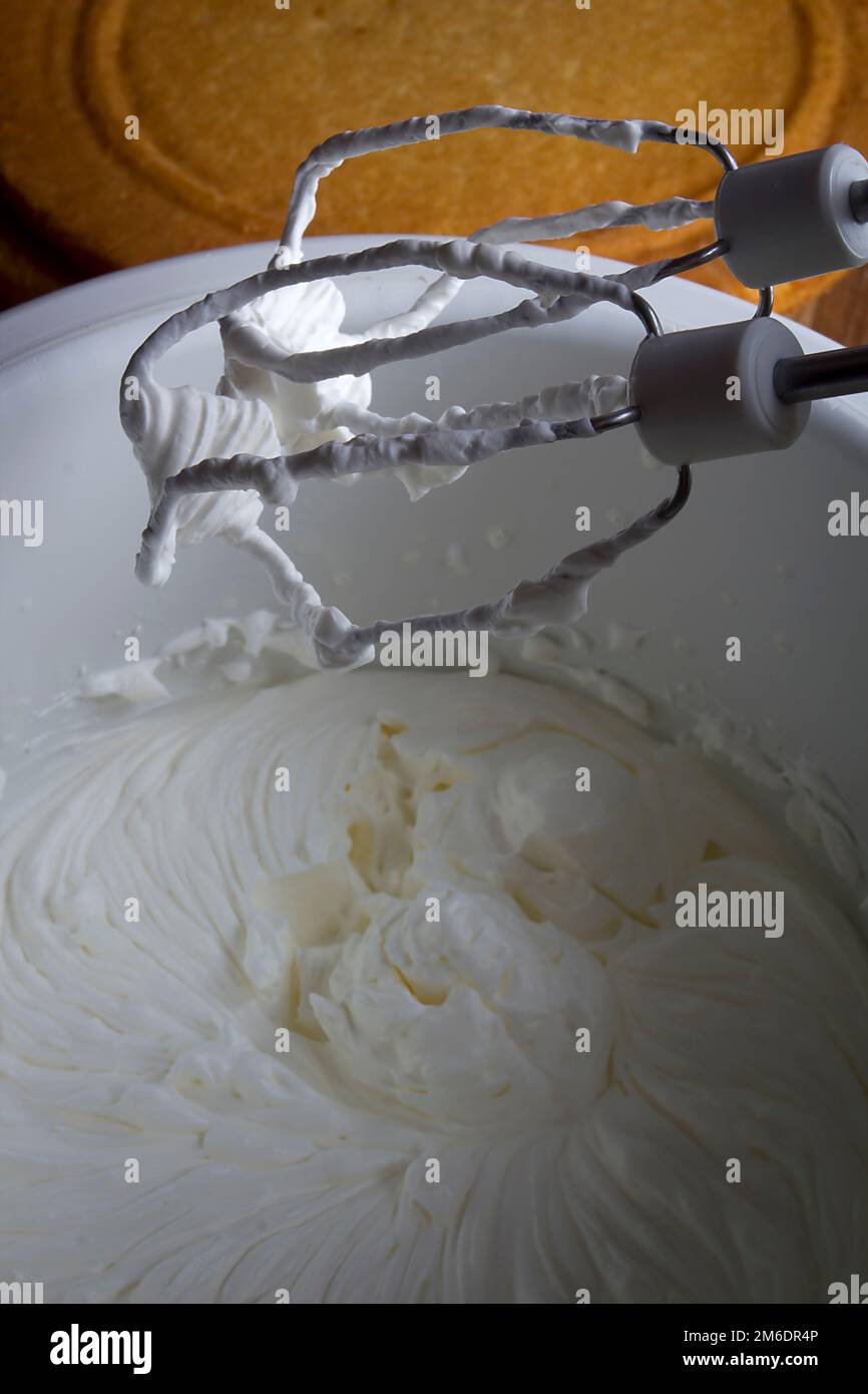 Whipped cream in a mixer Stock Photo - Alamy