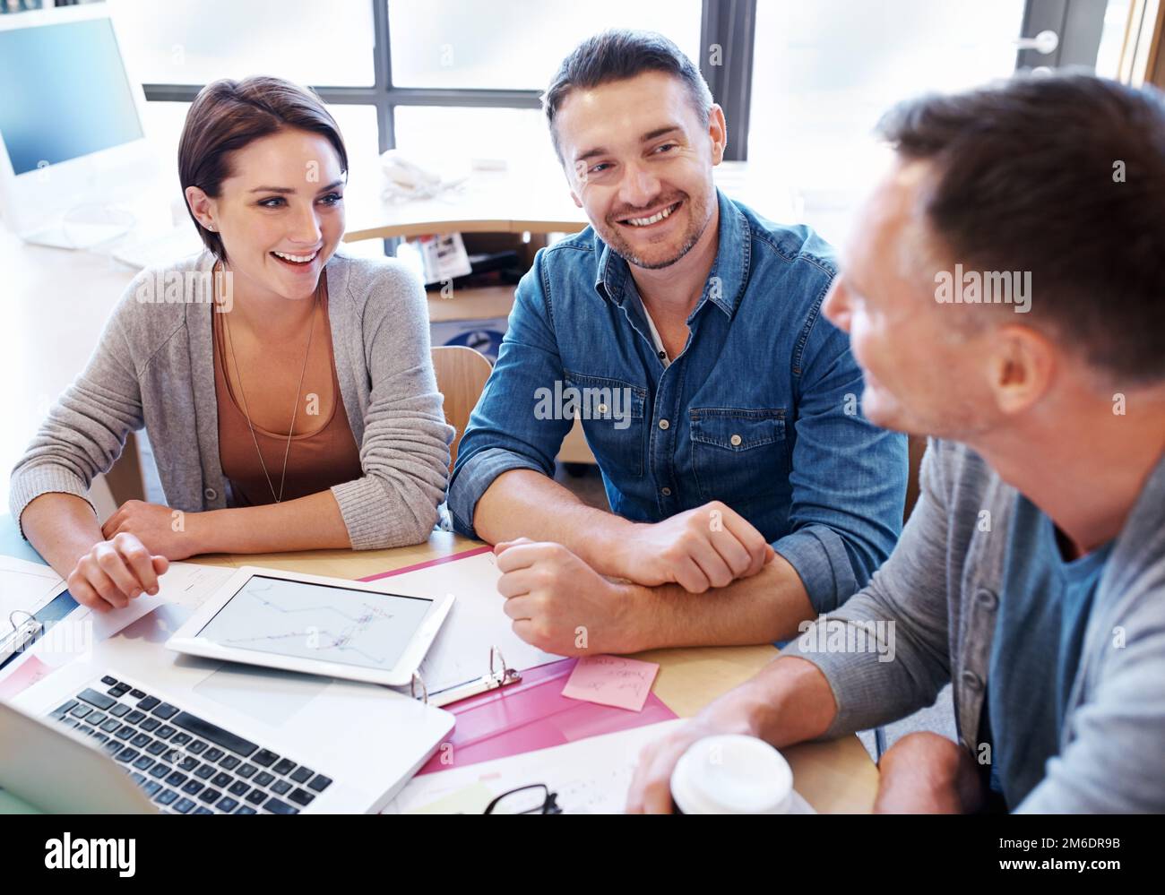 Young attractive man sitting table hi-res stock photography and images ...