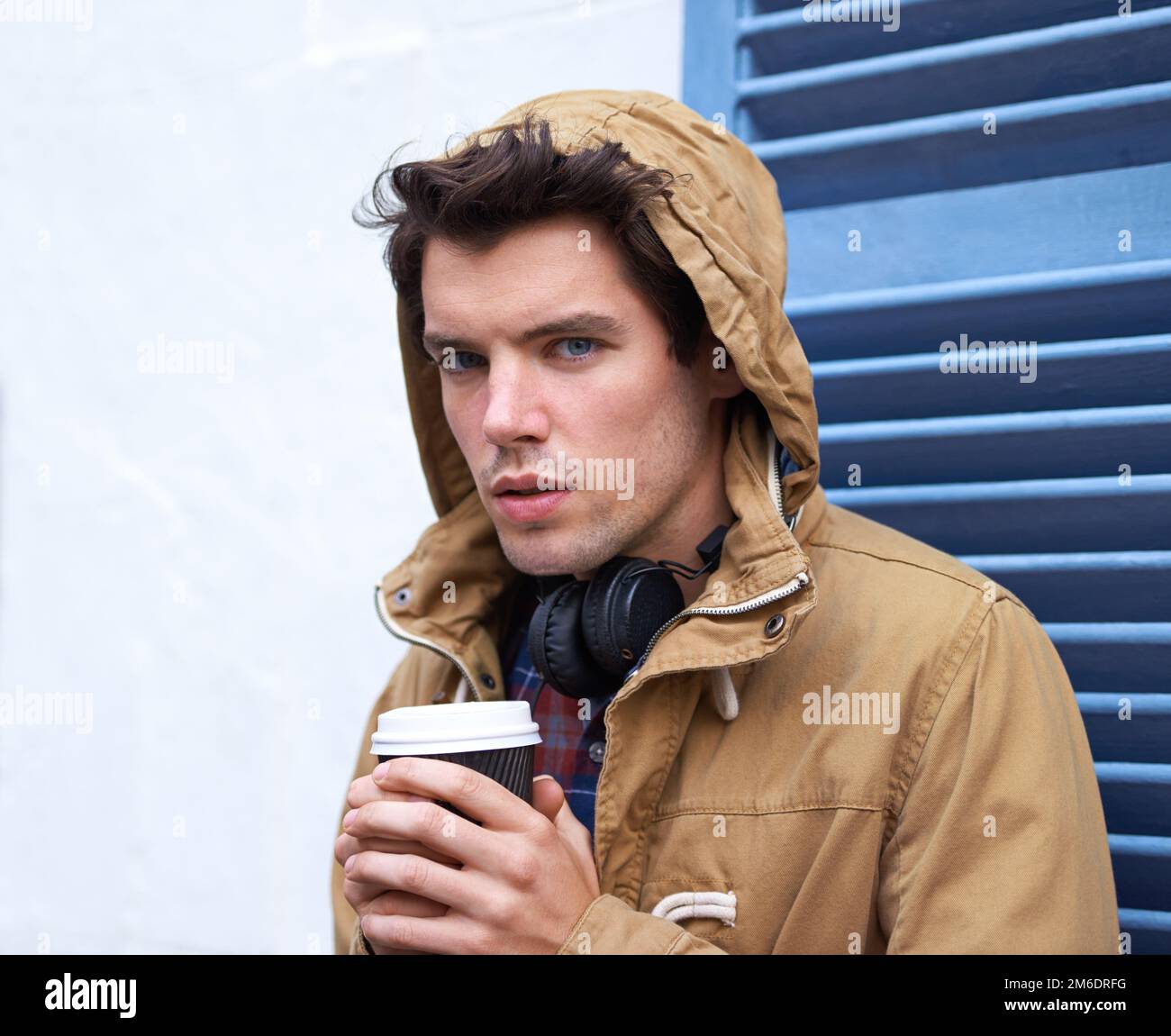 Out and about, around downtown. a handsome young man chilling in a ...