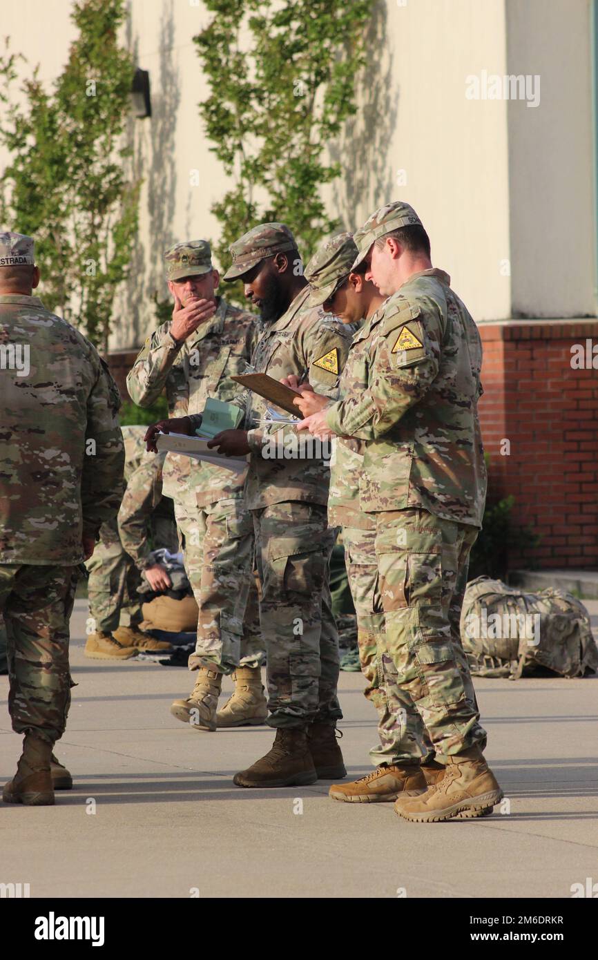 U.S. Army soldiers conduct a gear layout prior to the start of the ...