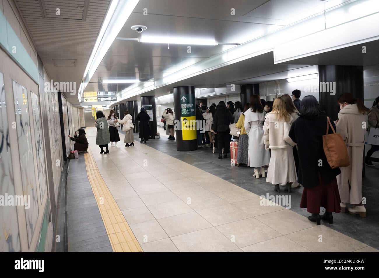 Tokyo, Japan. 3rd Jan, 2023. Women line up to take pictures with an ...