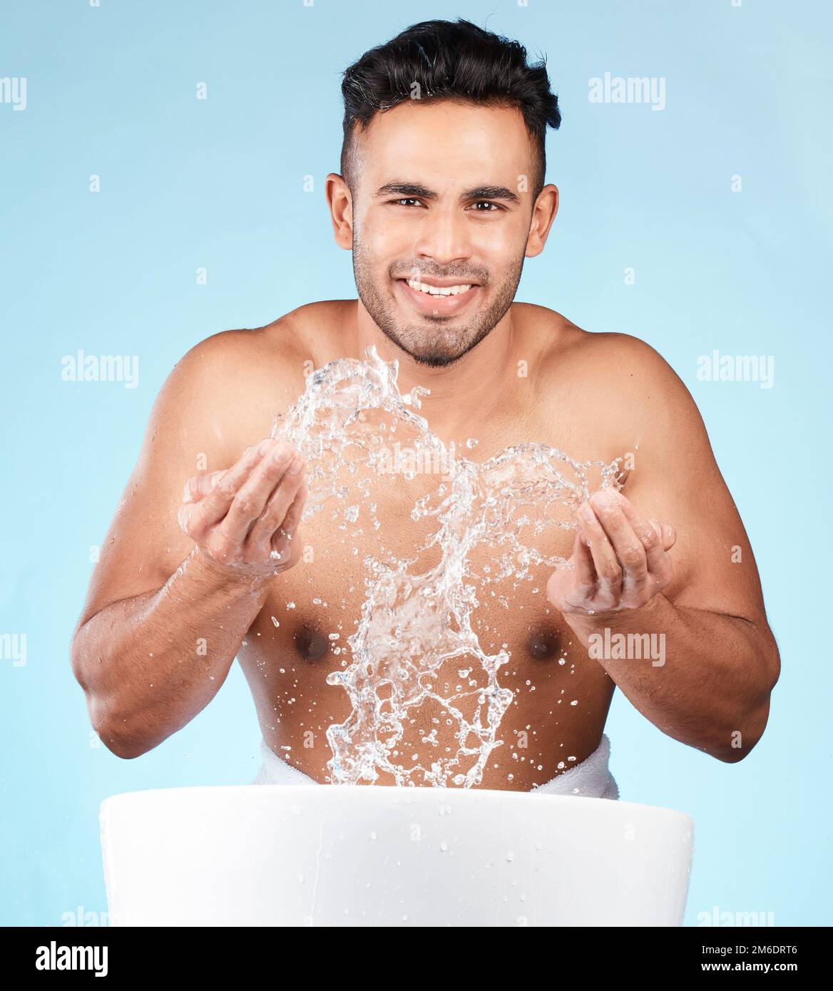 Cleaning, water splash and portrait of man happy with self care routine, facial hygiene and body ...