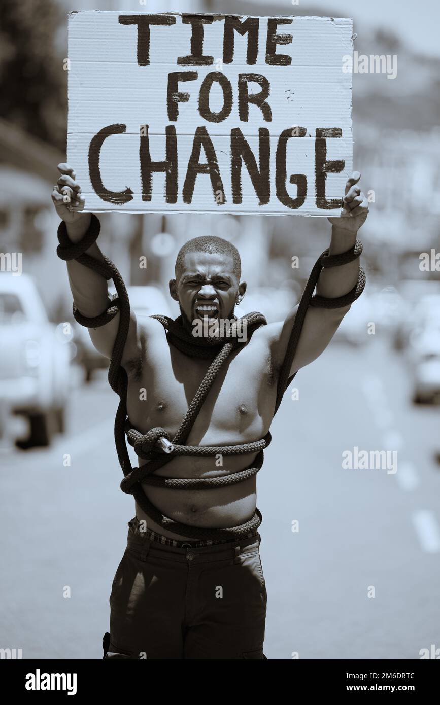 Protest, city and portrait of a man with a poster against ...