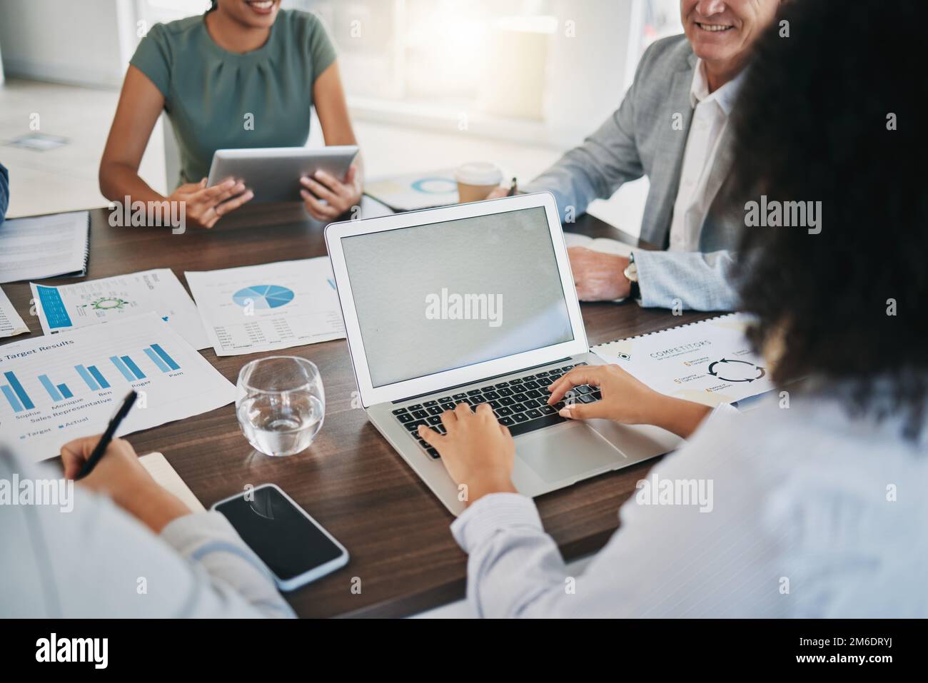 Laptop, teamwork and business people with documents in meeting. Mockup ...