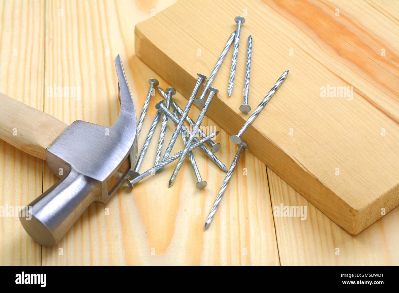 claw hammer with nails and timber on table Stock Photo - Alamy