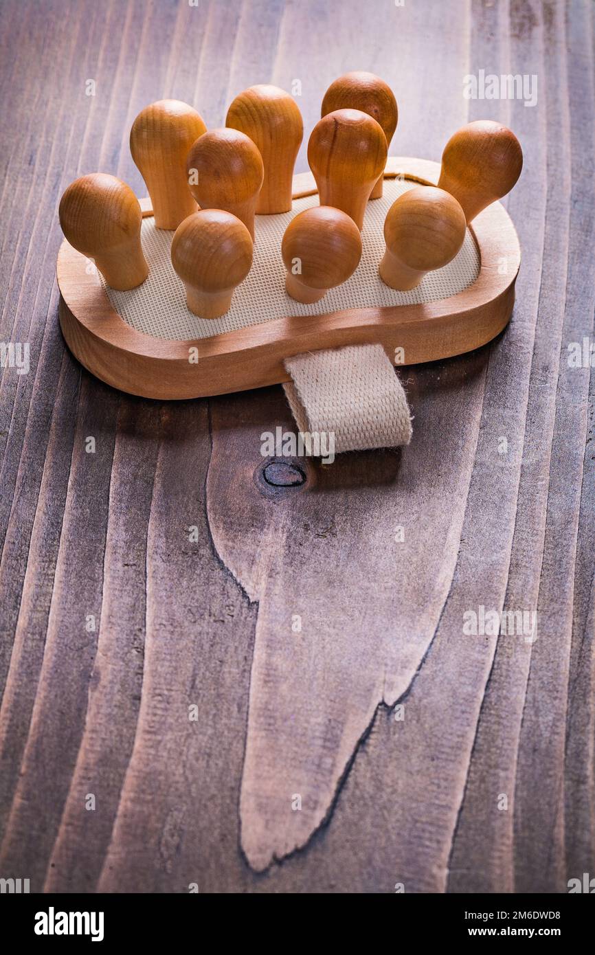clasical wooden massager on vintage board Stock Photo - Alamy