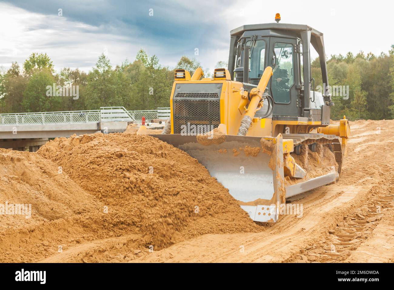 bulldozer moving sand Stock Photo - Alamy
