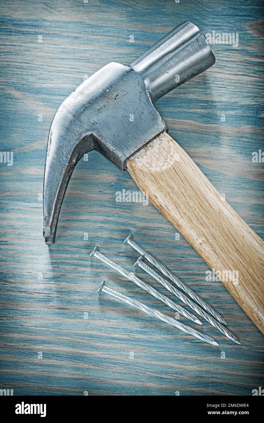 Claw hammer stainless nails on wooden board top view construction ...