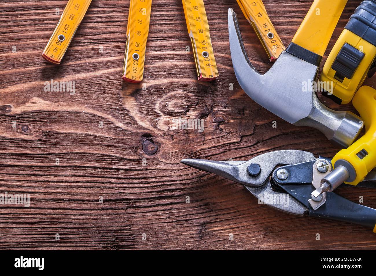 Collection of various working tools on wood board construction concept ...